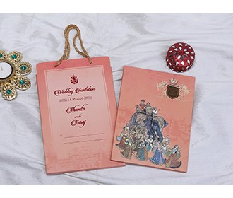Designer peach colour royal Indian wedding card in bag style